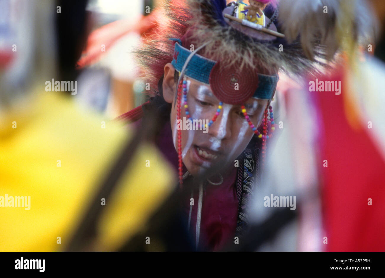 A Young Native American Man,Beating A Drum,& Singing At APow Wow In ...