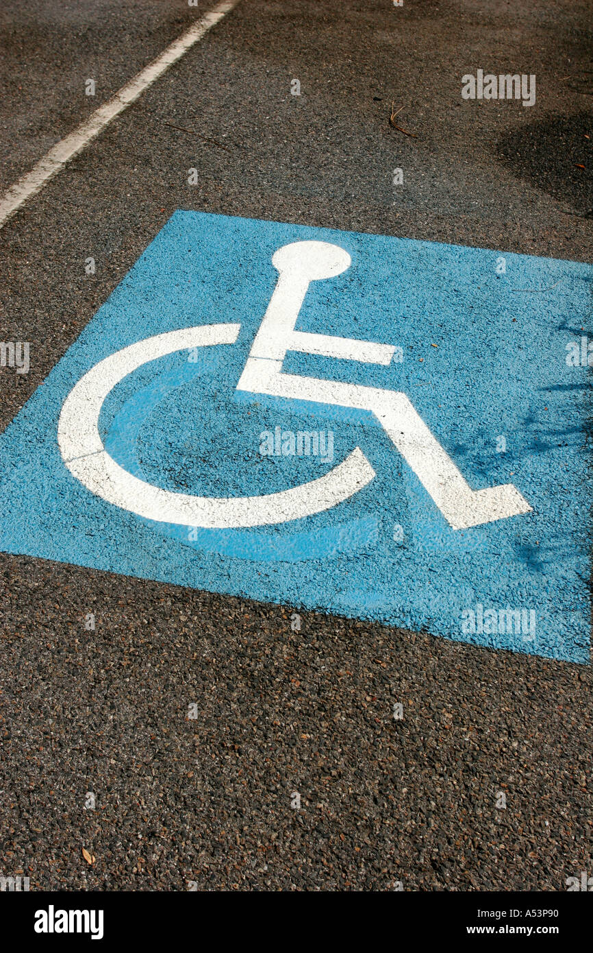 Disabled sign in a car parking space Stock Photo - Alamy
