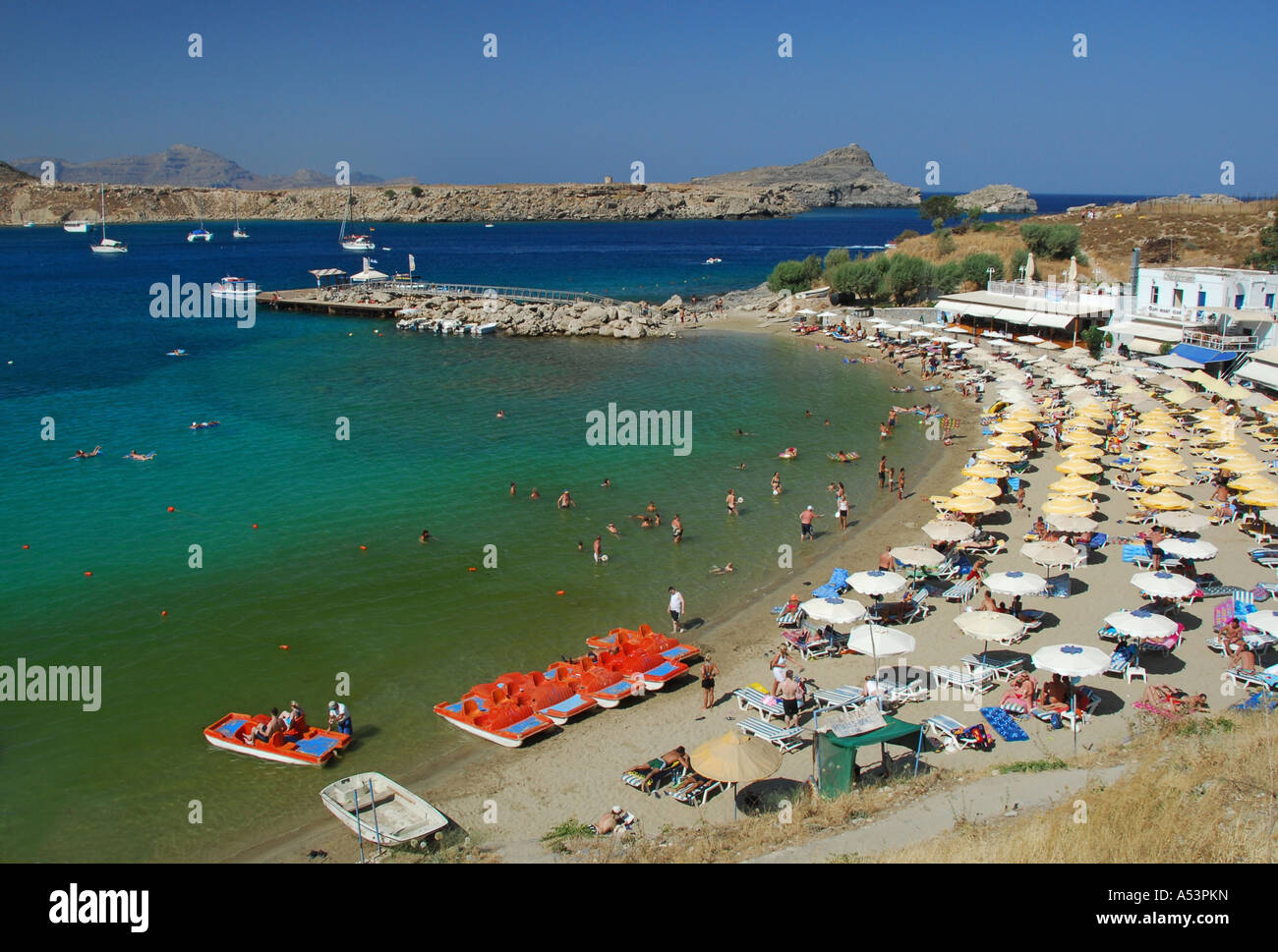 The smaller of the two beaches in Lindos Bay on the Greek island of ...