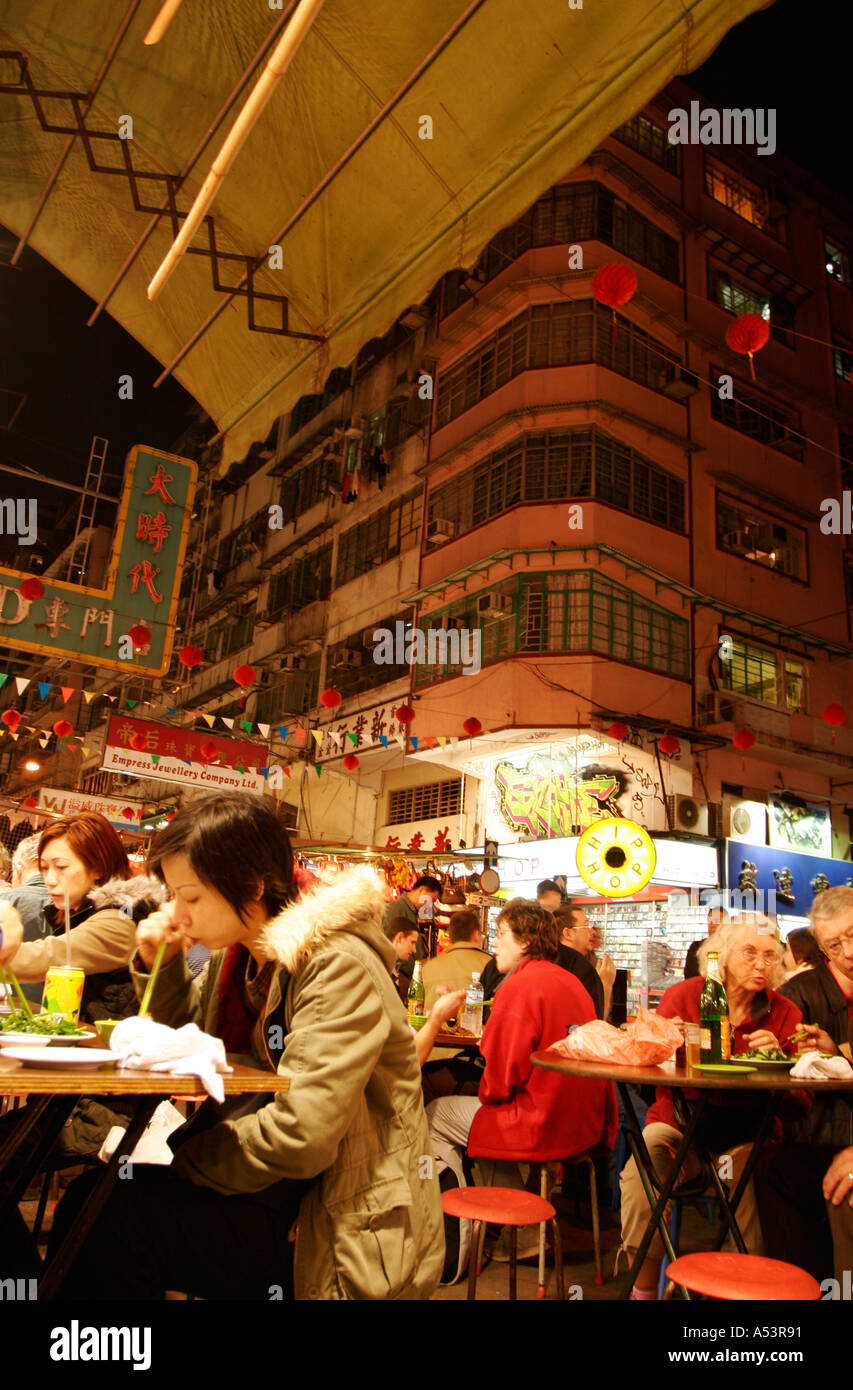 Chinese people eating at an outdoor restaurant in Hong Kong Stock Photo ...