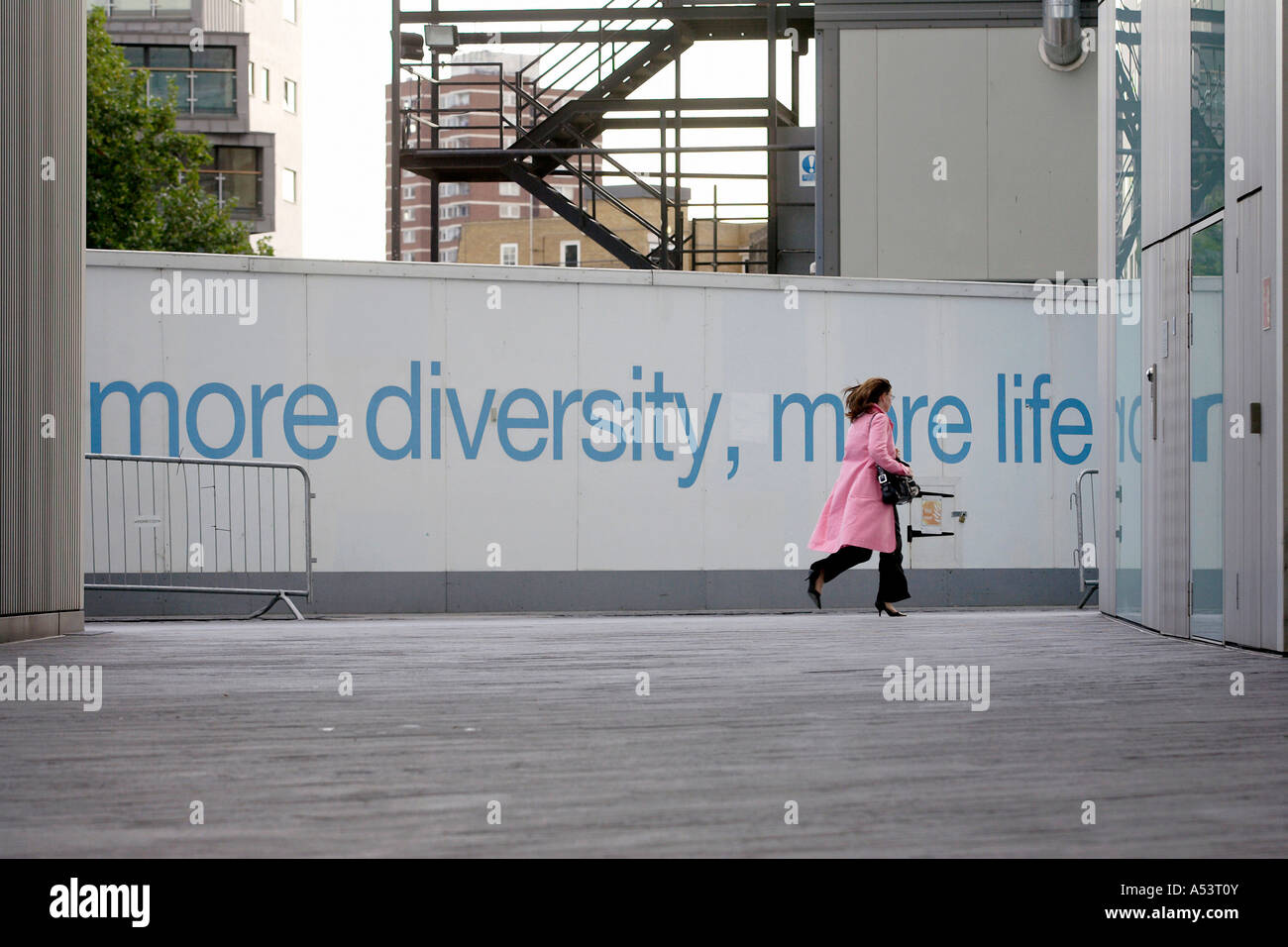 MORE DIVERSITY, MORE LIFE and a walking woman, London, Great Britain ...