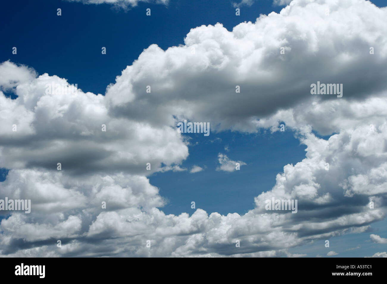 Clouds forming a ring circle in the sky Stock Photo - Alamy