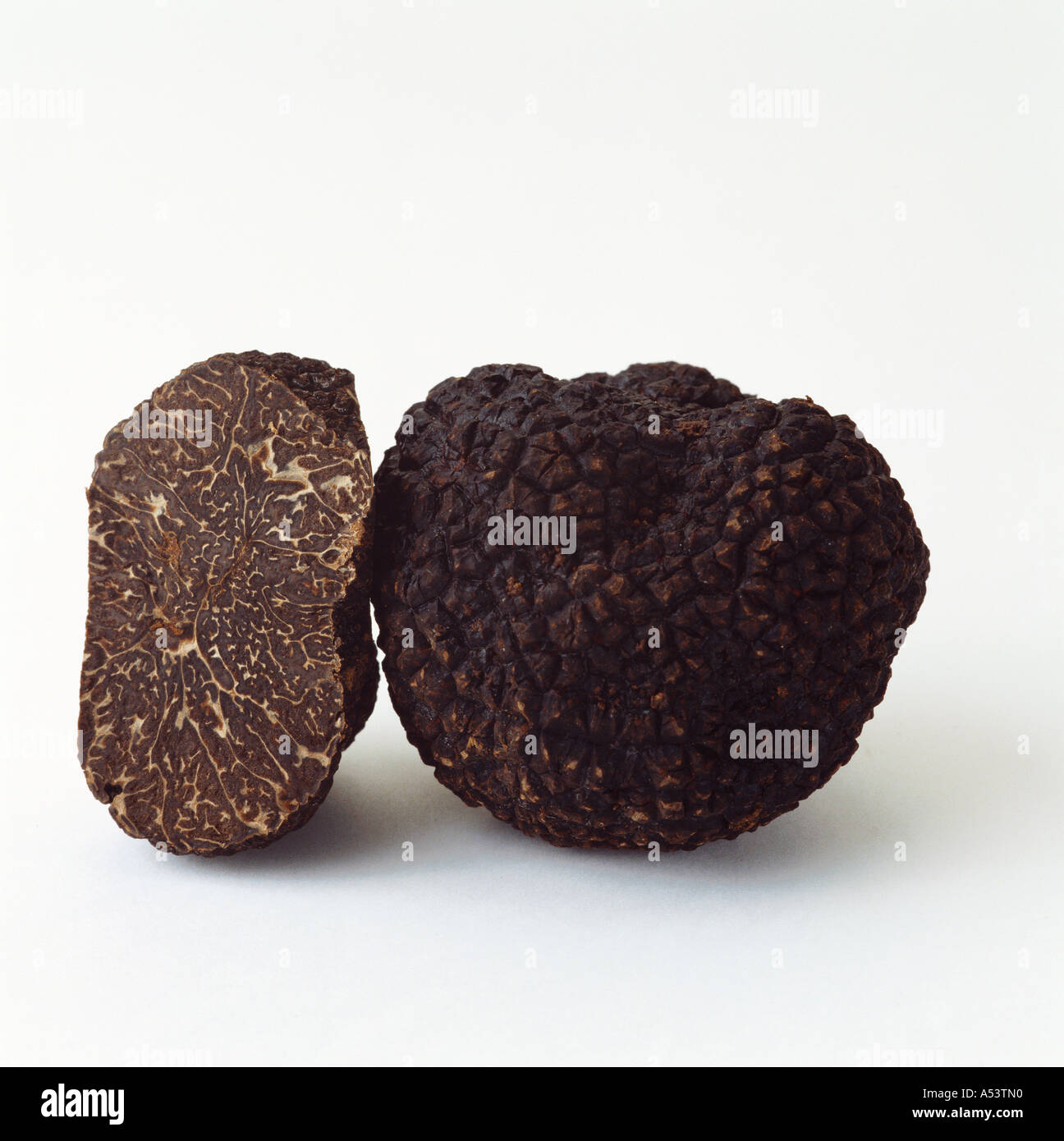 Whole and half black truffle from Perigord Stock Photo - Alamy