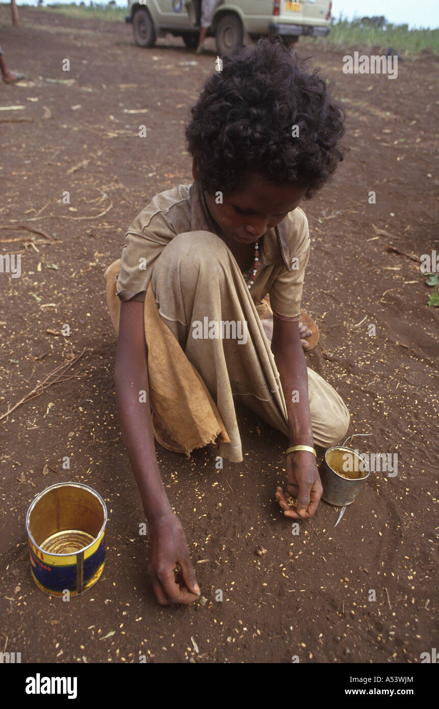 Painet ha2176 4399 boy ethiopia hungry villager gathering individual ...