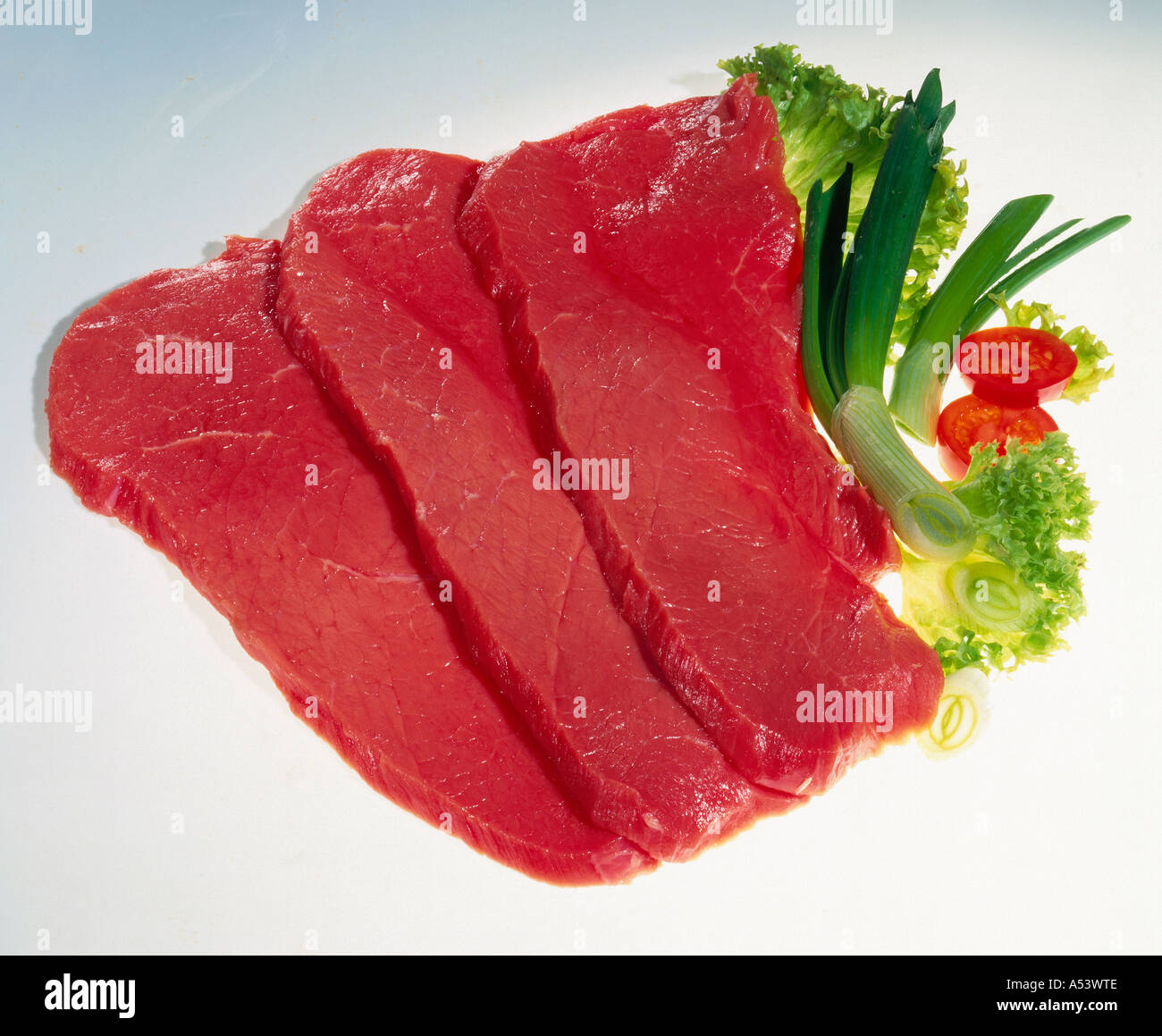 Three lean pork escalopes from the leg Stock Photo - Alamy