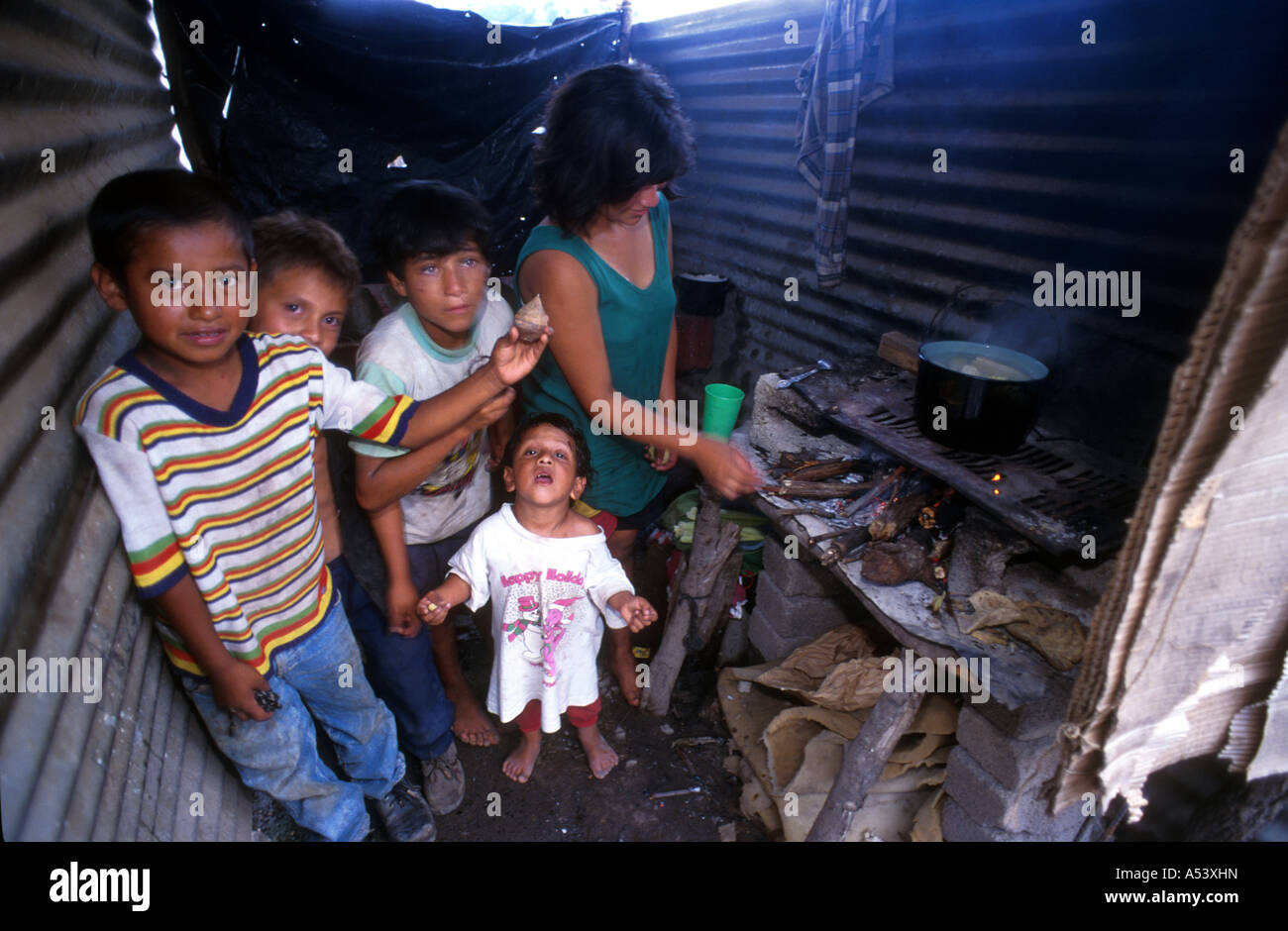 Painet ha2281 5102 guatemala slums woman children kitchen shantytown ...