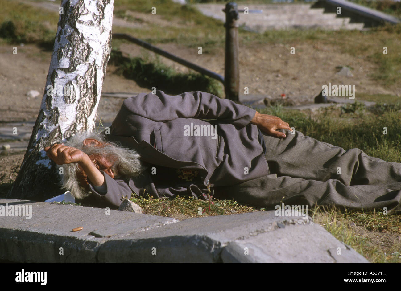 Painet ha2305 5128 russia poverty drunk man asleep street ulan ude ...