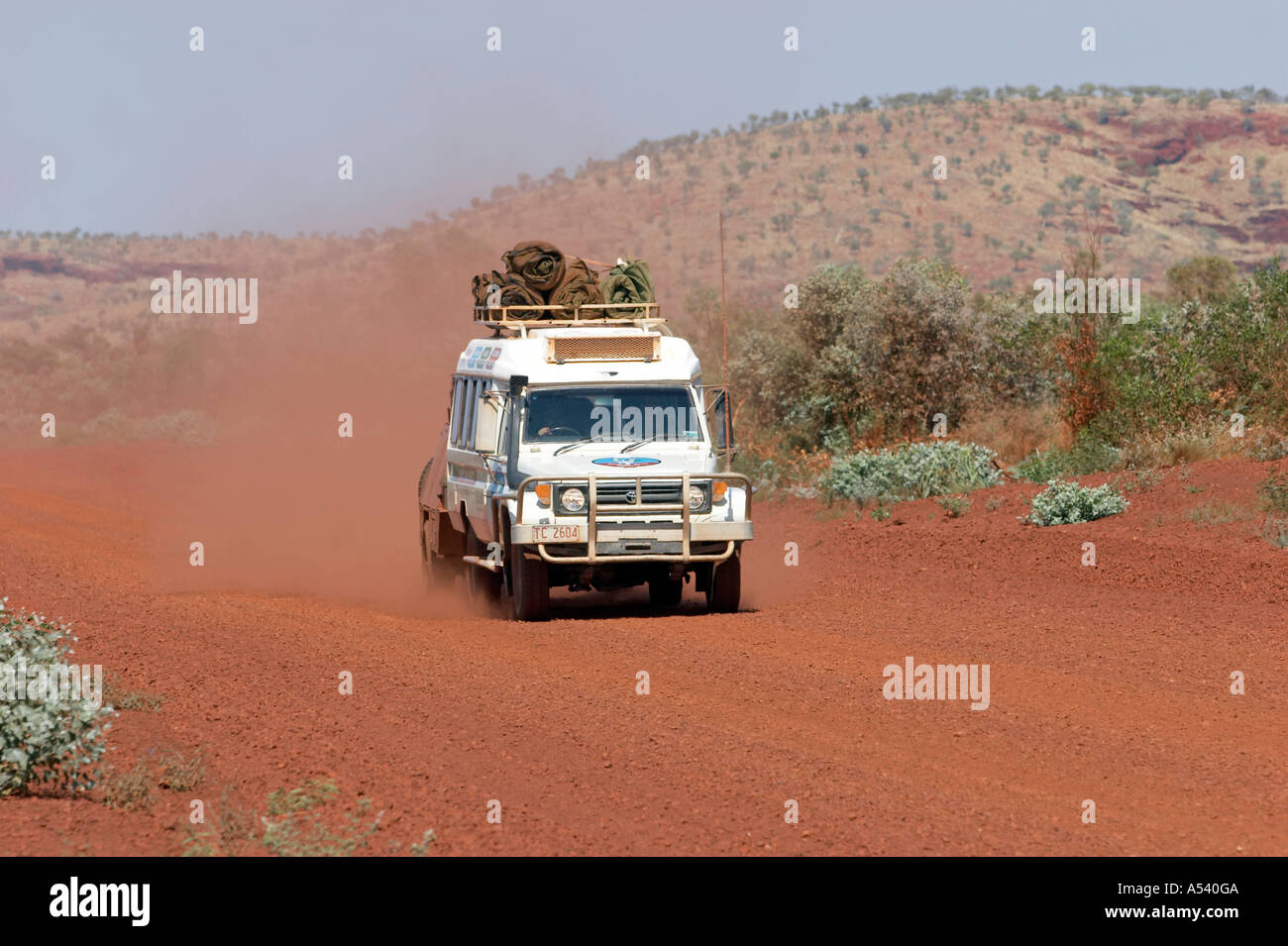 Toyota Landcruiser FJ 75 Arkana safari car with trailer driving on a ...