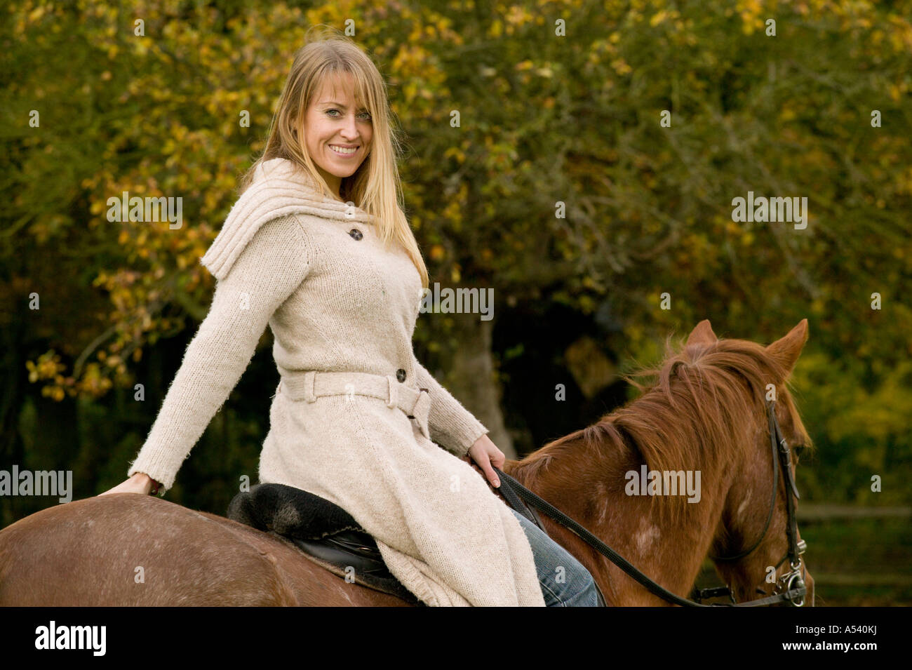 Young woman horse riding hi-res stock photography and images - Alamy