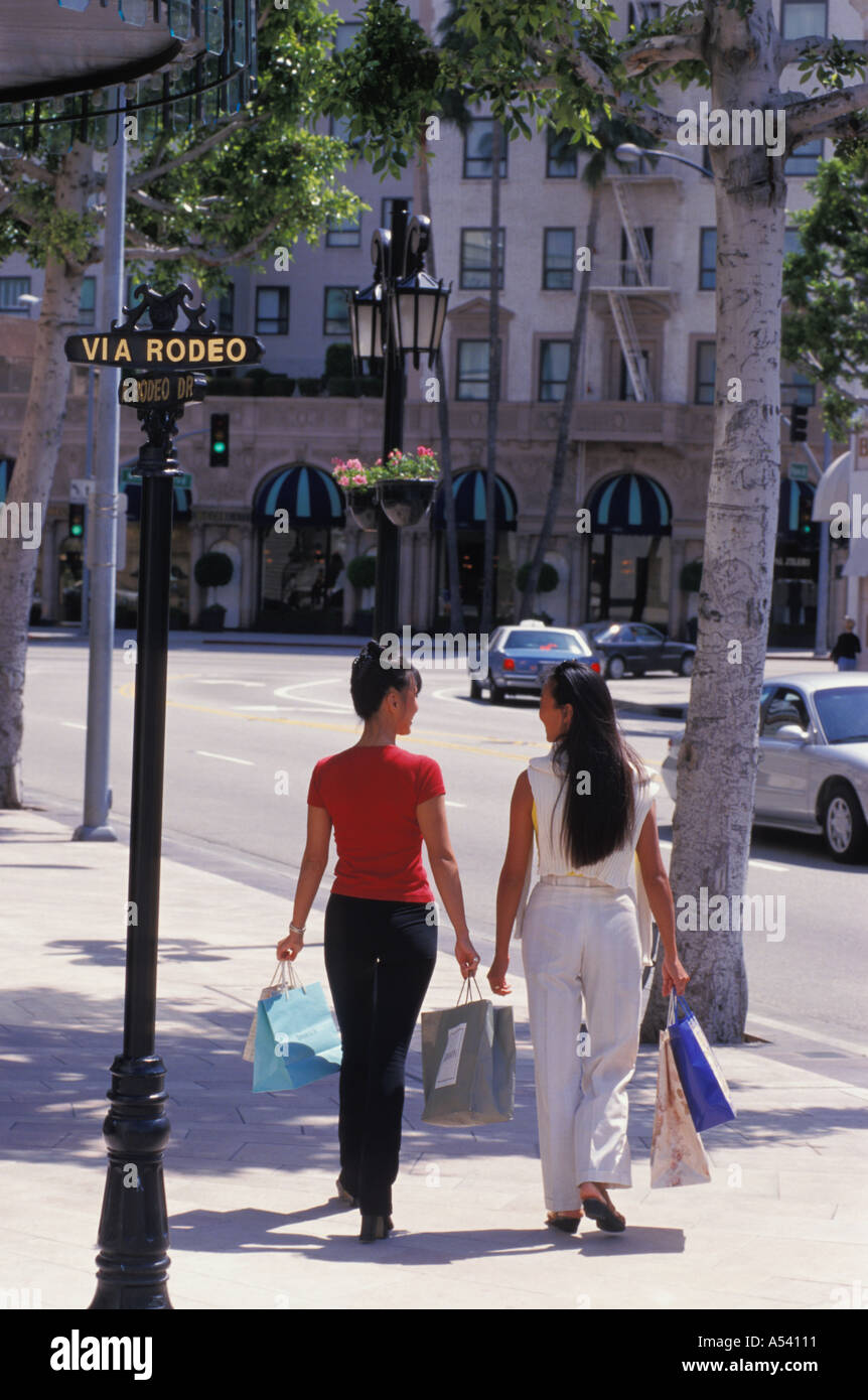 Two women with shopping bags on Rodeo Drive in Beverly Hills California ...