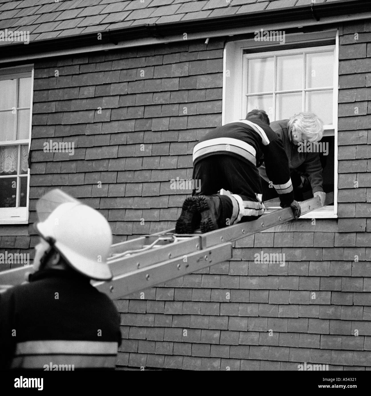 Firefighters rescuing elderly lady at Lewes floods East Sussex UK 2000 ...