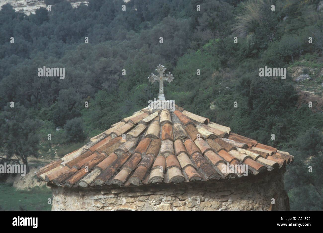 Roof of small church with cross and tiles Stock Photo - Alamy