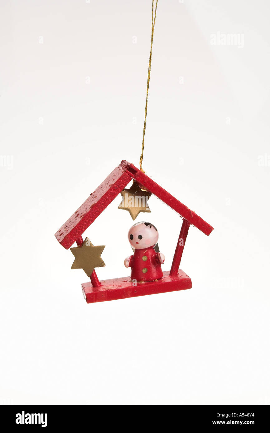 Wooden angel with crib as trimmings Stock Photo - Alamy