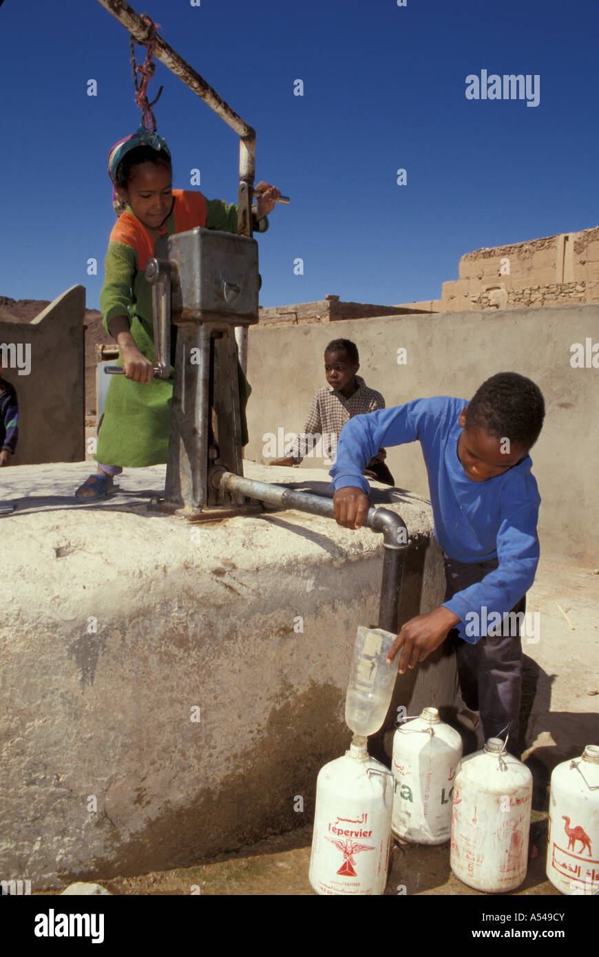 Painet hn1750 3344 morocco children collecting water handpumped well ...