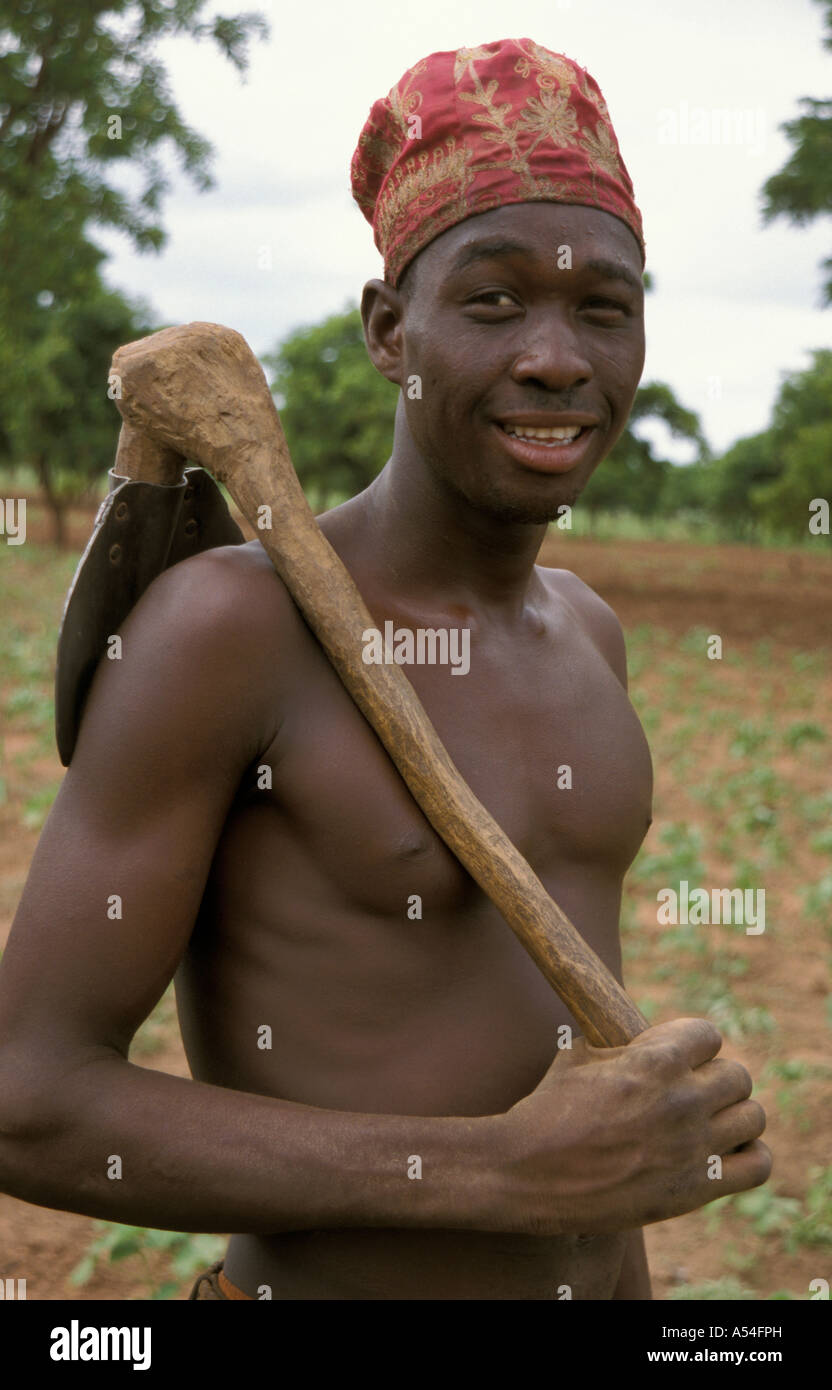 Painet hn2178 7682 ghana farmer man male holding hoe used for digging ...