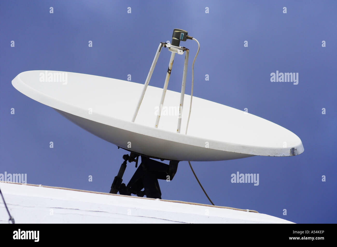 Rooftop satellite TV receiving dish Stock Photo - Alamy