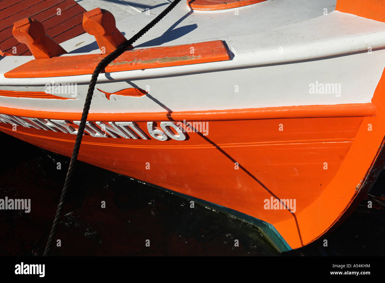 Closeup of bow of small orange wooden fishing boat Stock Photo - Alamy