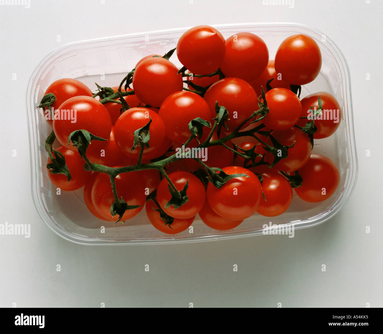 Cherry tomatoes in plastic punnet Stock Photo - Alamy