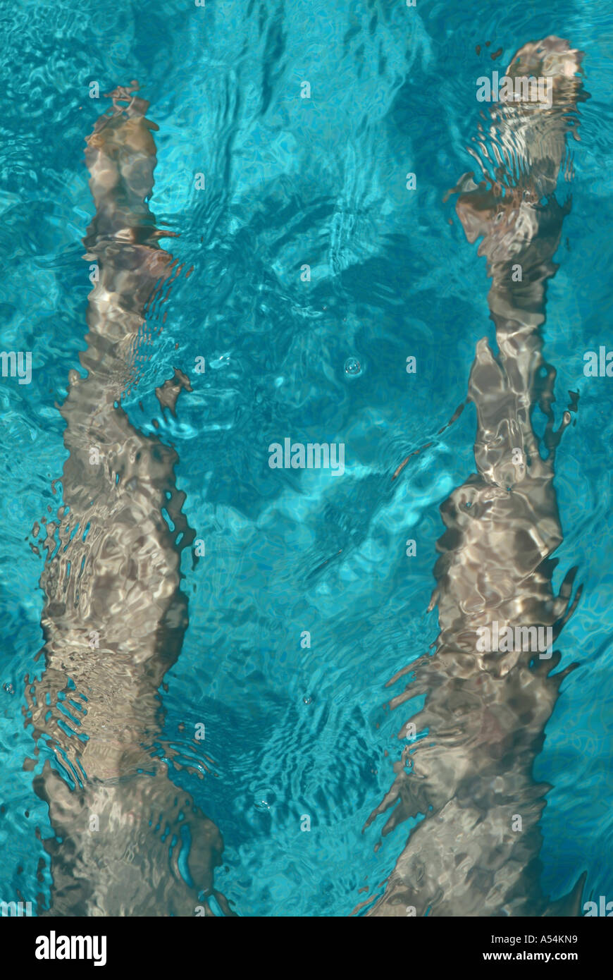 Legs of a swimmer in a pool with refraction Stock Photo - Alamy