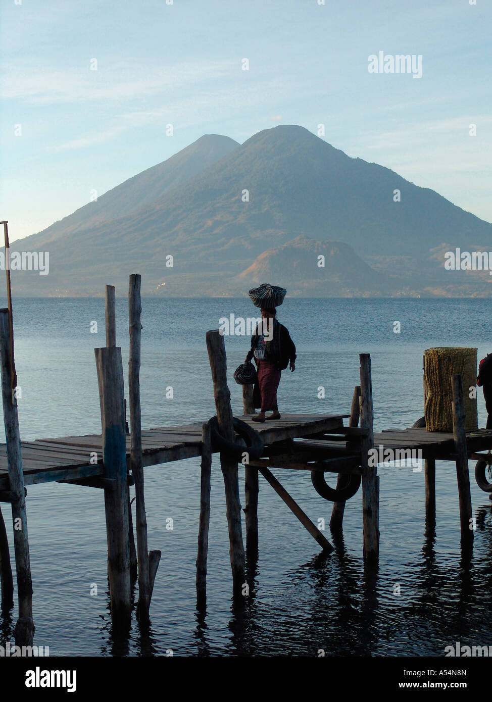 Painet ip1676 guatemala woman carrying basket getting off boat lake ...