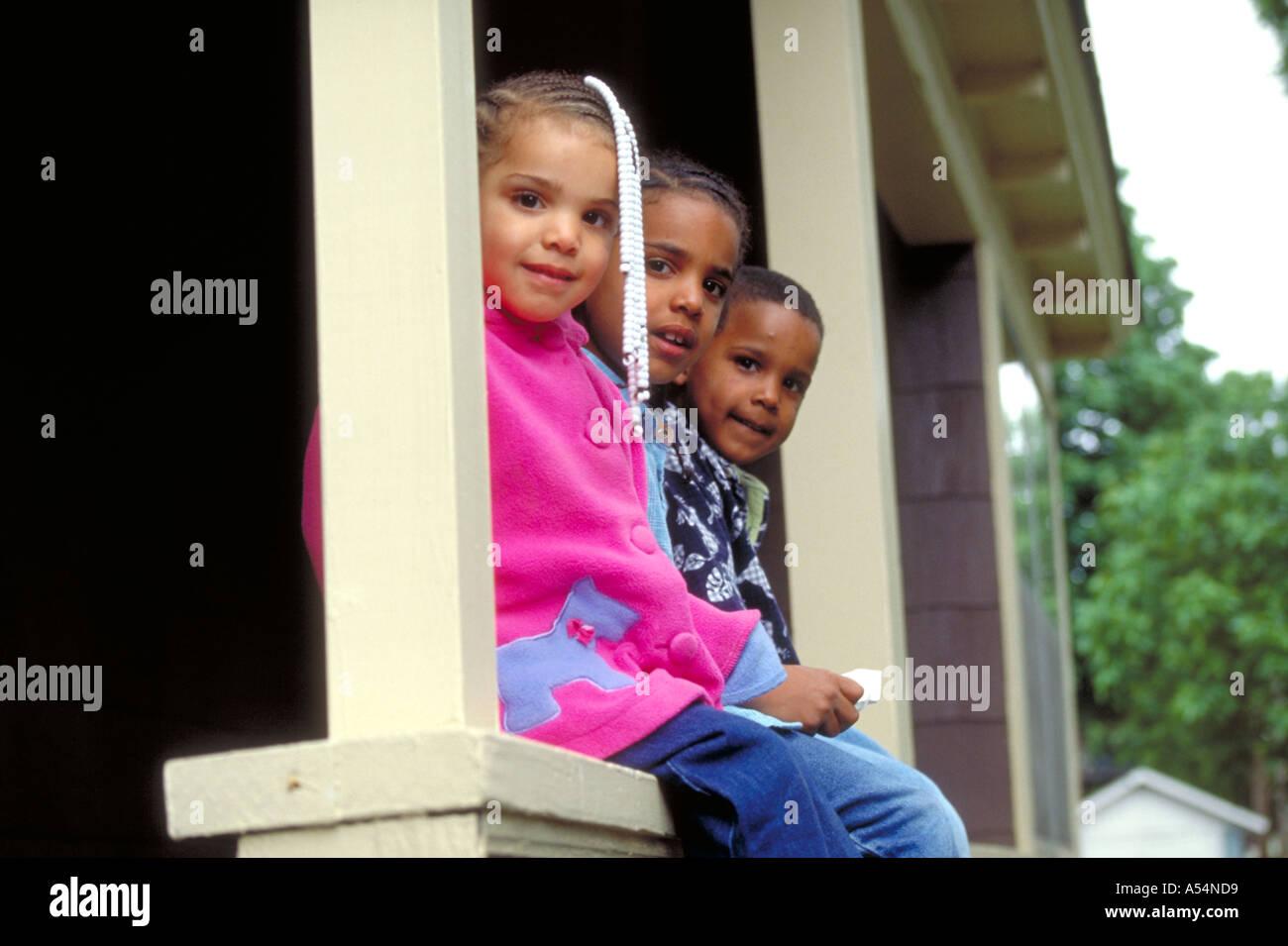 Three black kids sitting on the porch St Paul Minnesota Stock Photo - Alamy
