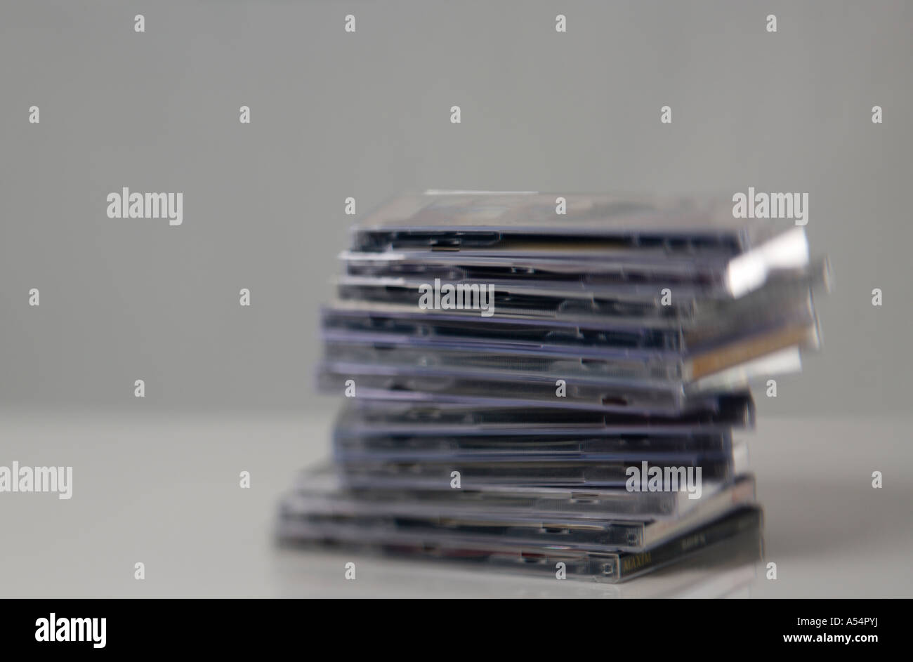 Stack of CD cases standing upright sitting on a white base Stock Photo ...