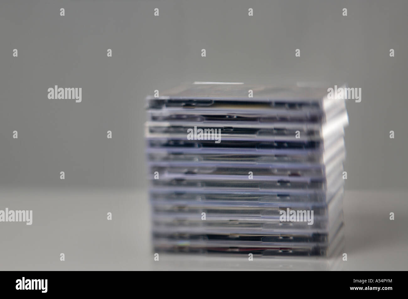 Stack of CD cases standing upright sitting on a white base Stock Photo ...