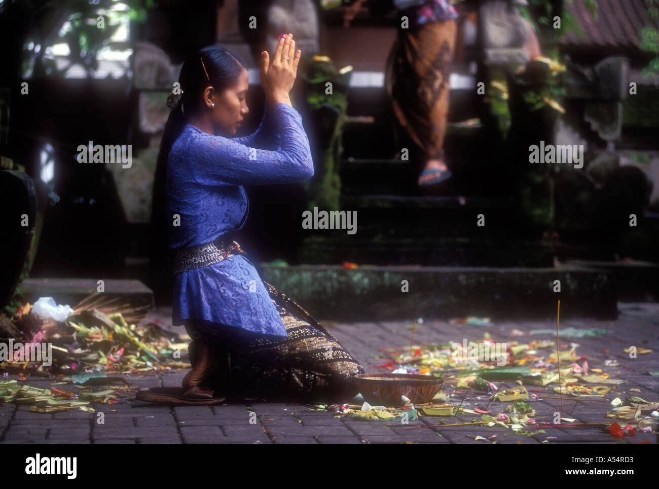Balinese Hindu women praying at temple in Bali Indonesia Stock Photo ...