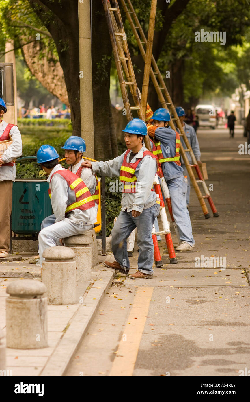 Power line workers Shamian Island Guangzhou China Stock Photo - Alamy