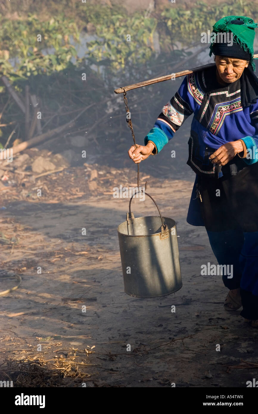 Woman carring water hi-res stock photography and images - Alamy