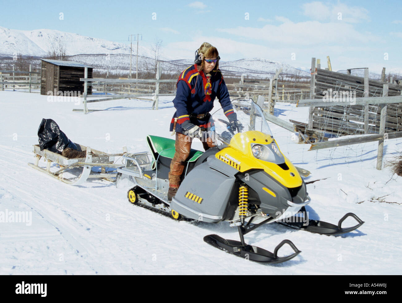 Nils Ante Kuhumen Sami Lapp reindeer herder on his snowmobile in the ...