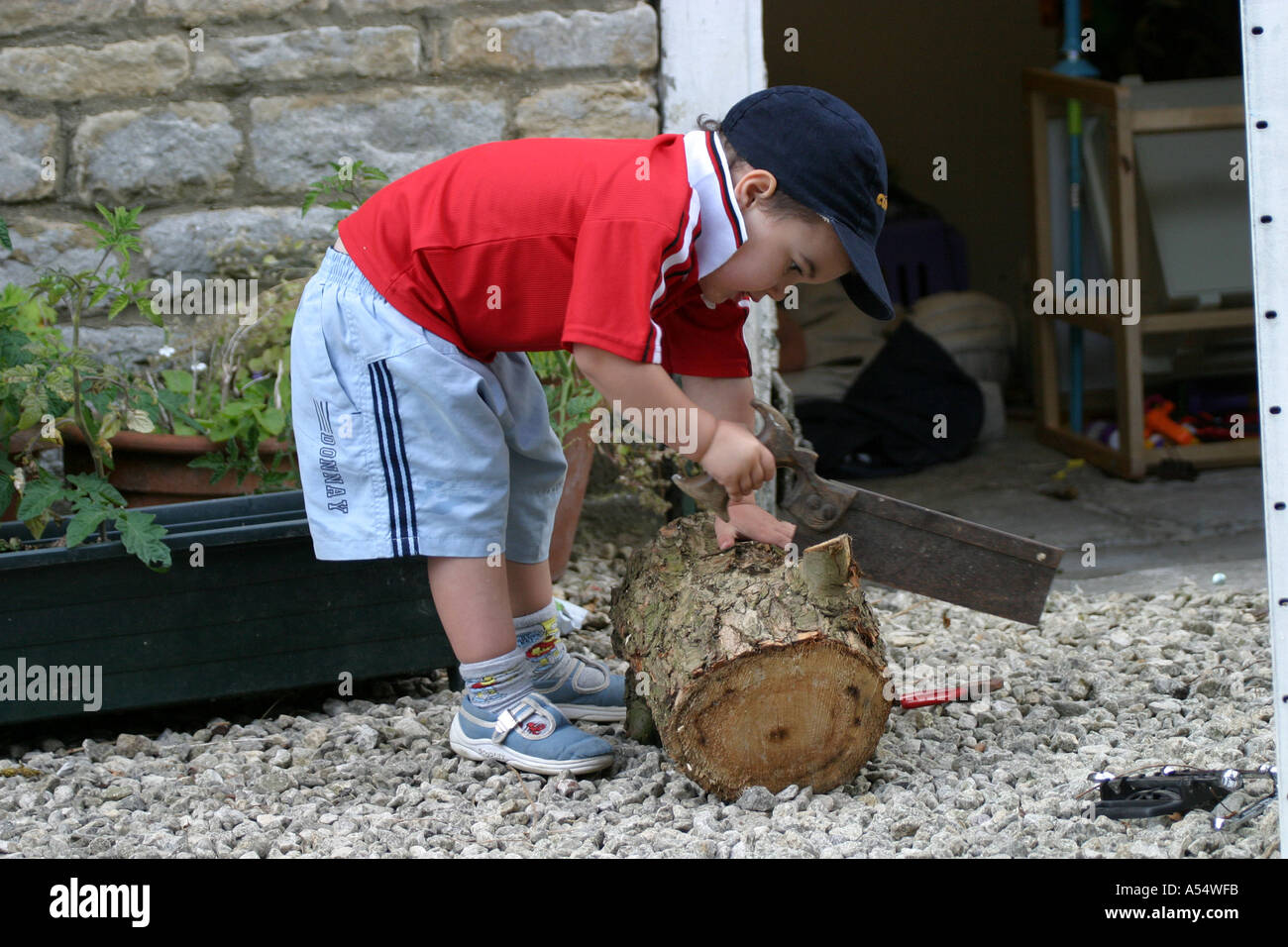 Sawing boy hi-res stock photography and images - Alamy