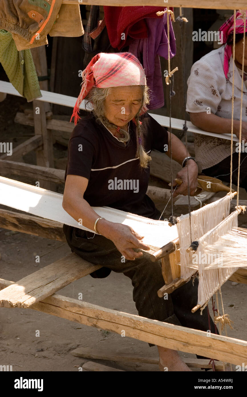Aini woman weaving cloth in a village South of Jinghong China Stock ...