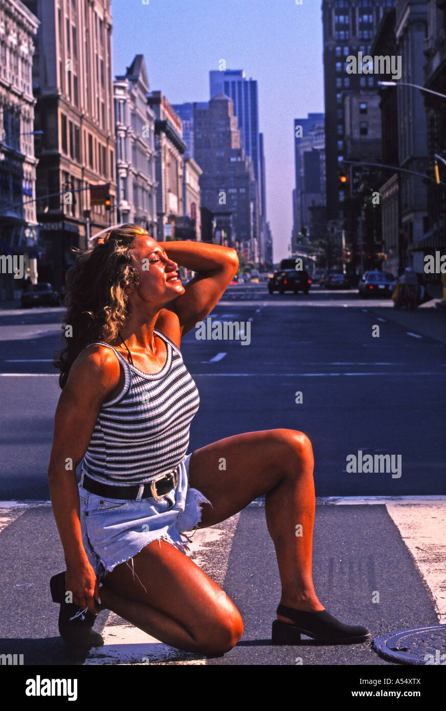 female bodybuilder posing on 6th Avenue NYC Stock Photo - Alamy