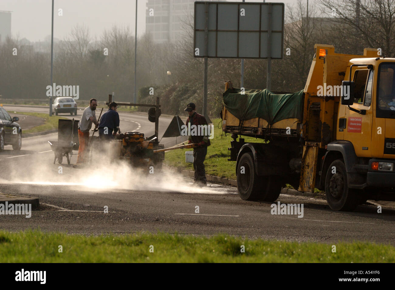 Road construction gang of workers making lots of heat and steam Stock ...