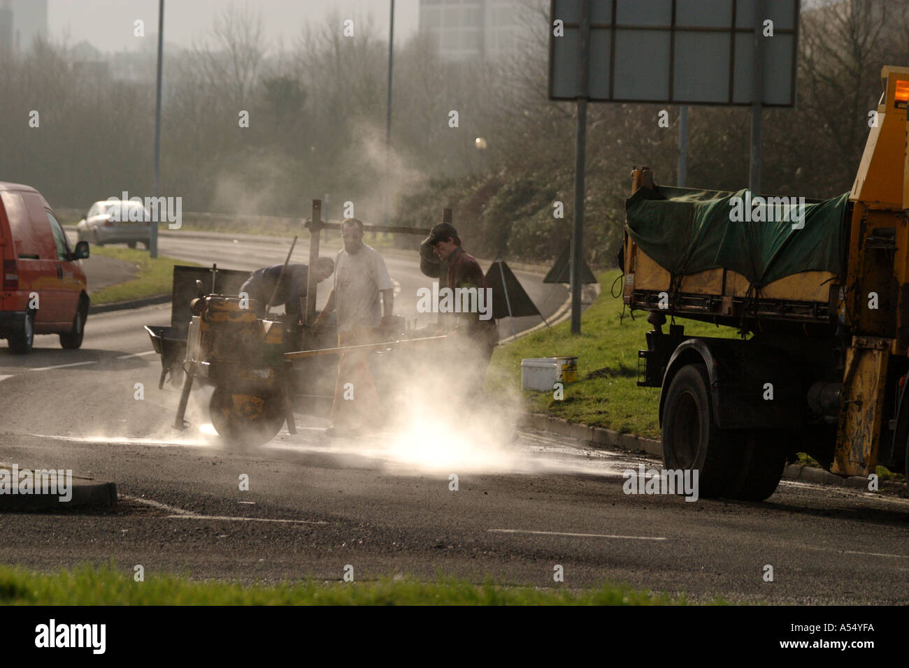 Road construction gang of workers making lots of heat and steam Stock ...