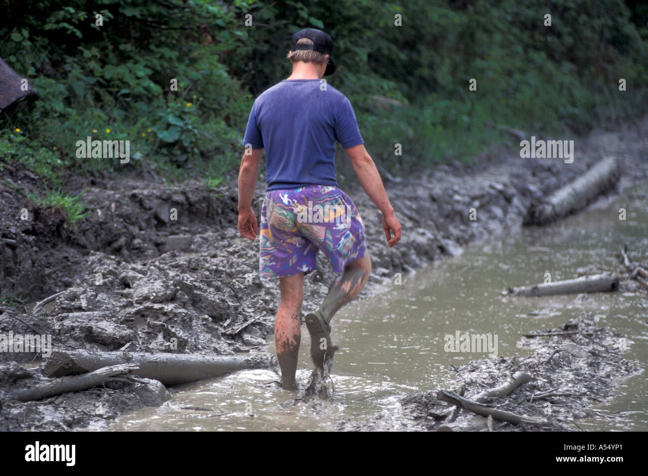 Men feet running in mud hi-res stock photography and images - Alamy
