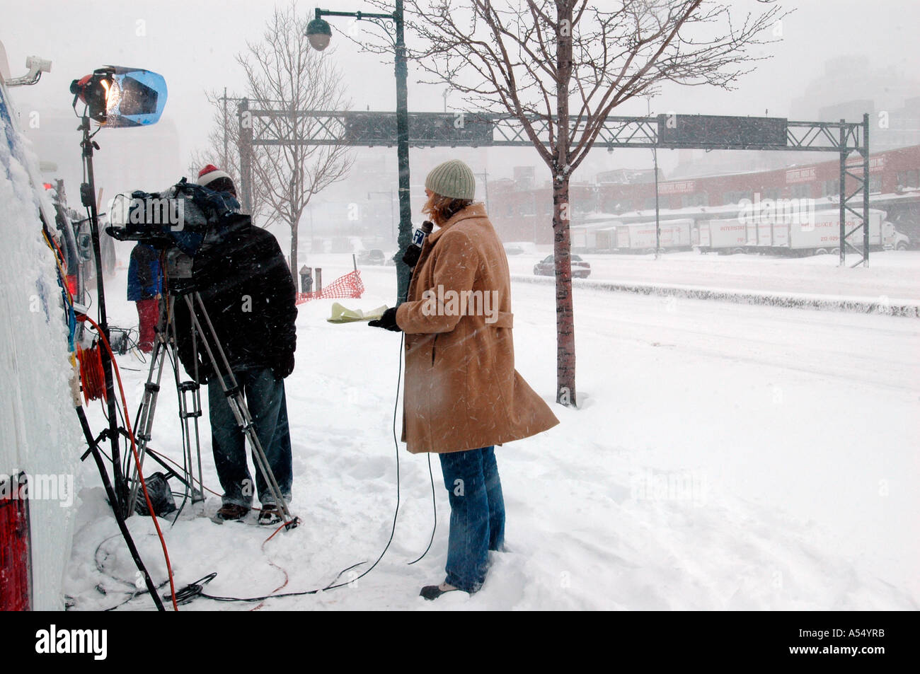 Television reporter does stand up in Hudson River Park in New York City ...