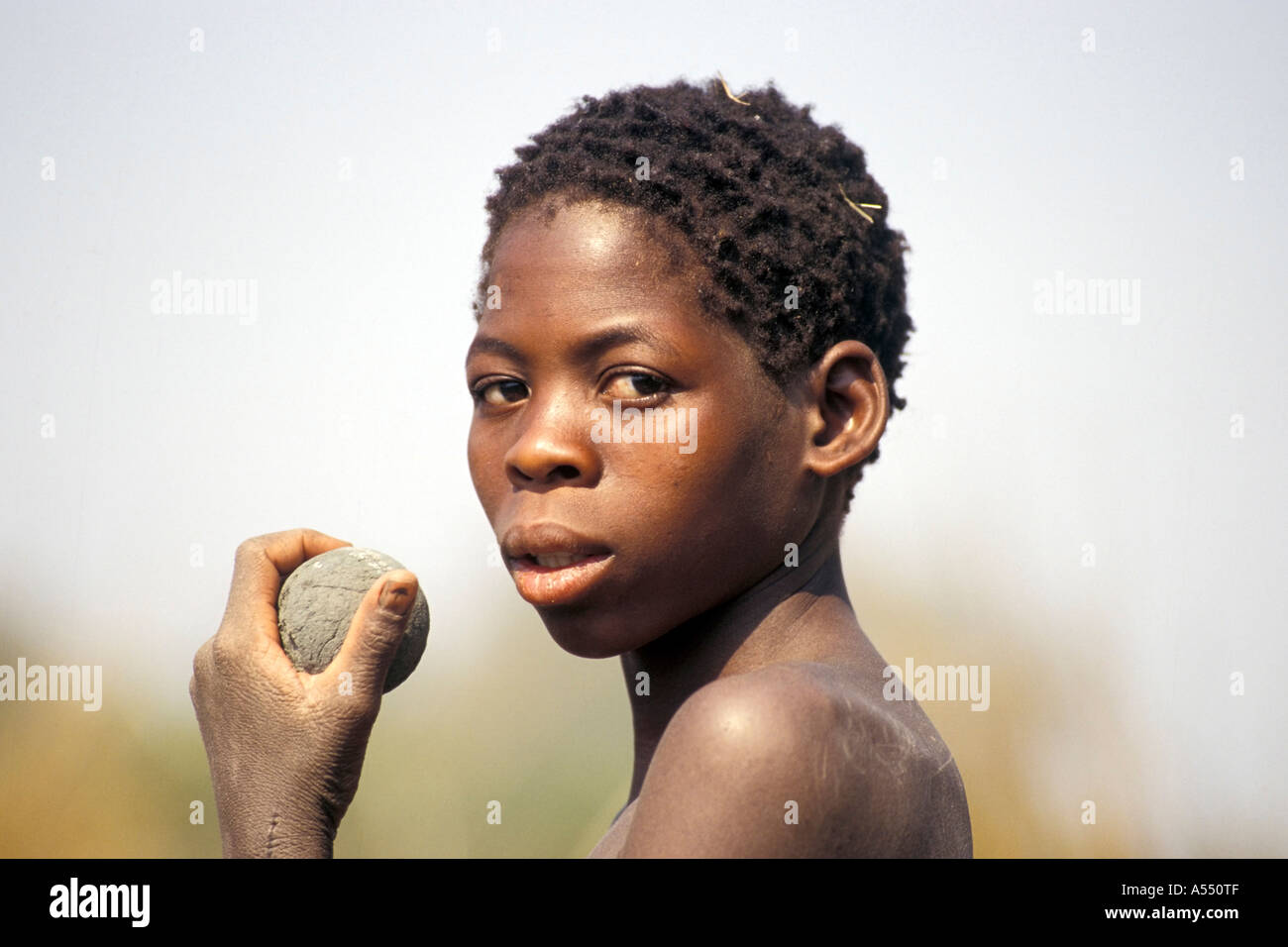 Black boy with a ball in his hand Botswana Stock Photo - Alamy