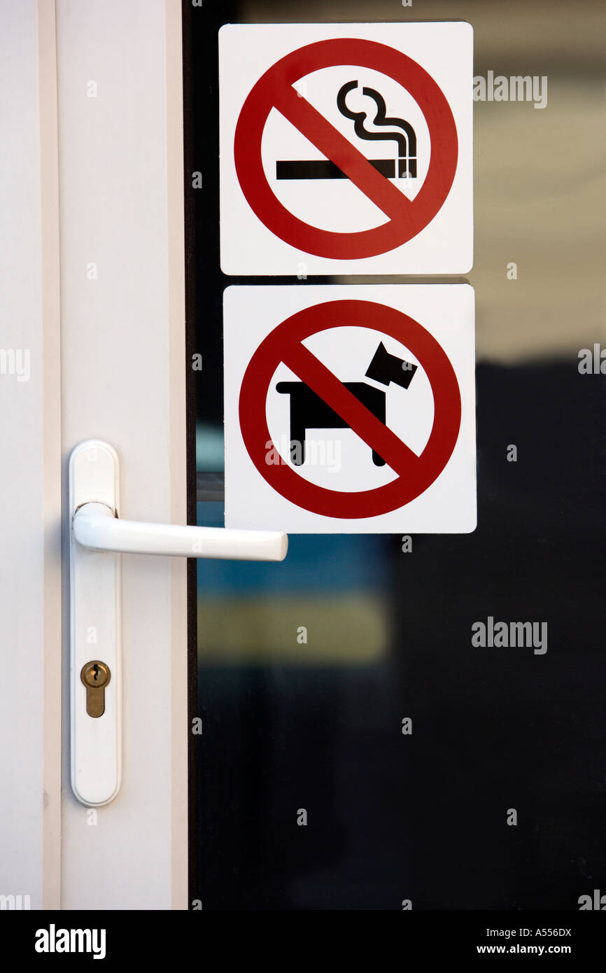 No Smoking, no dogs signs on door Stock Photo - Alamy