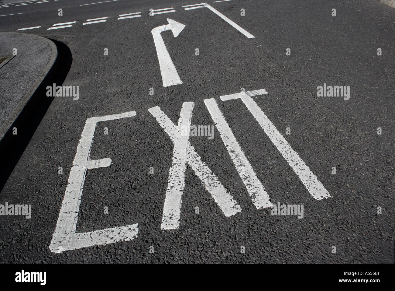 Exit sign painted on tarmac Stock Photo - Alamy