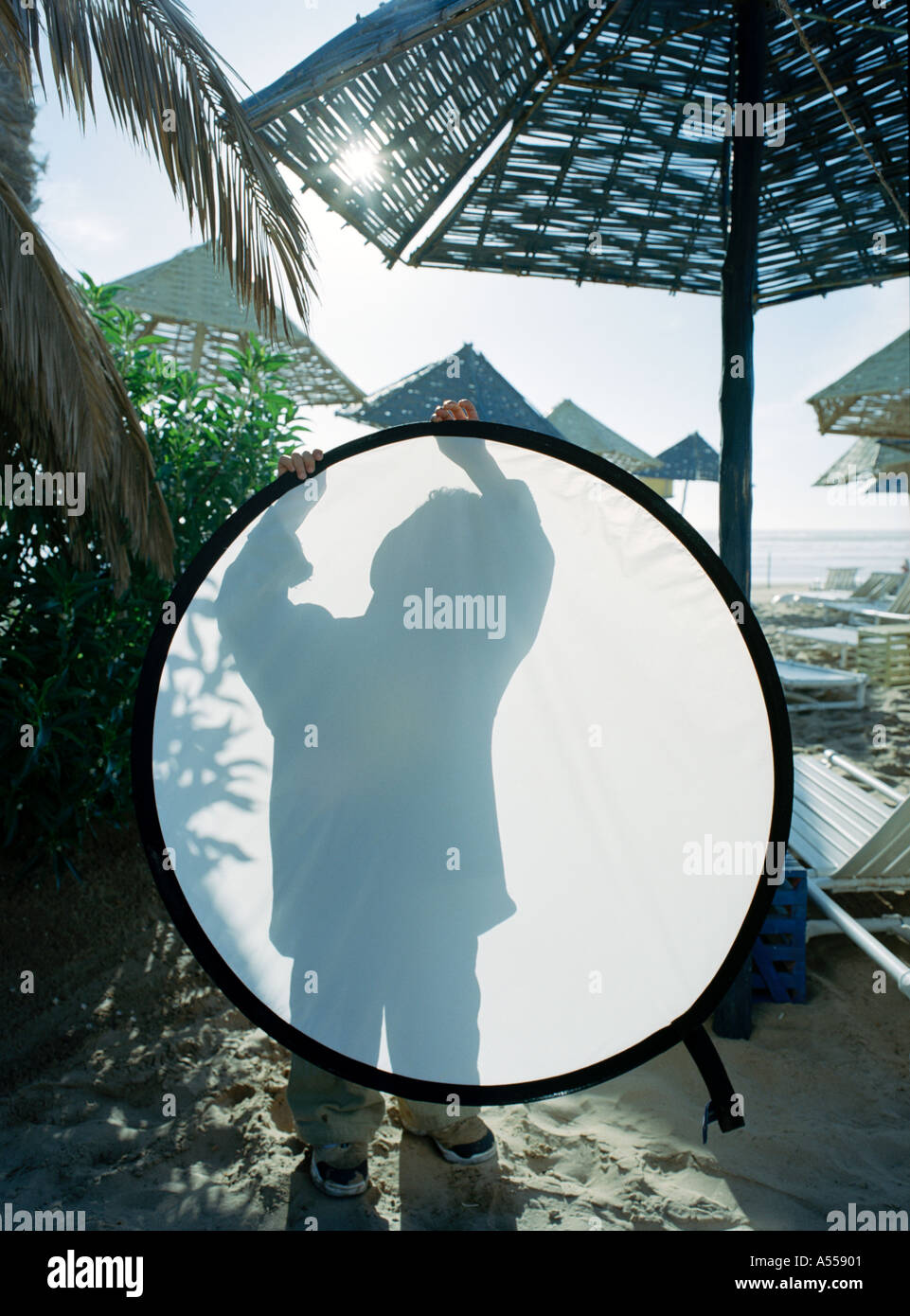 Boy holding a circular shade Stock Photo - Alamy