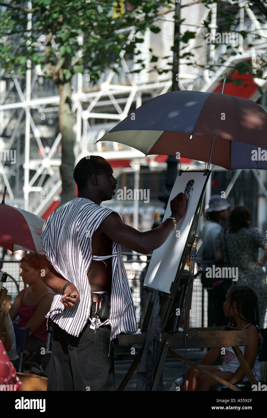 An artist at work near the Pompidou Centre Paris Stock Photo - Alamy