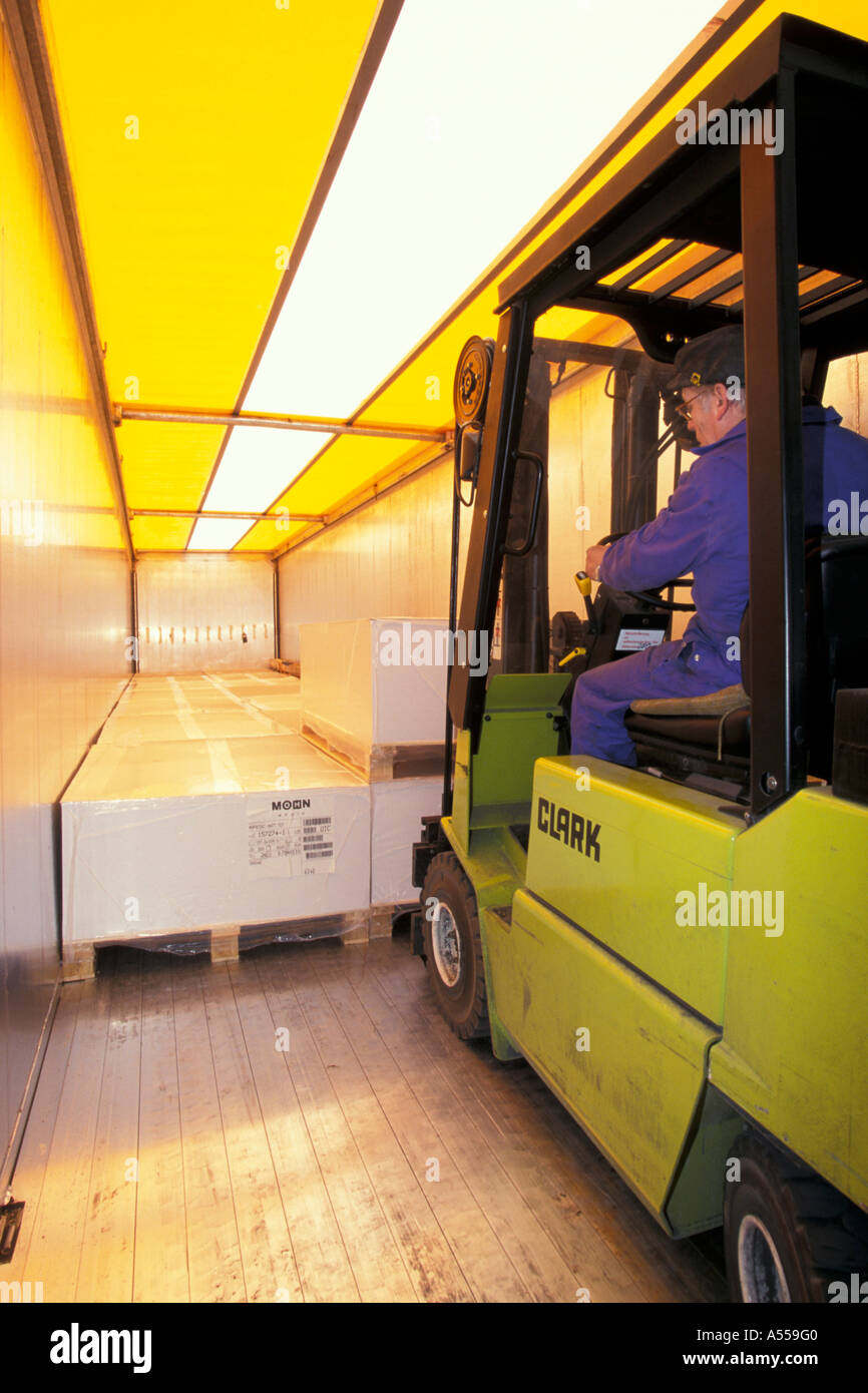 Loading of a truck with a lift truck fork lift Stock Photo - Alamy