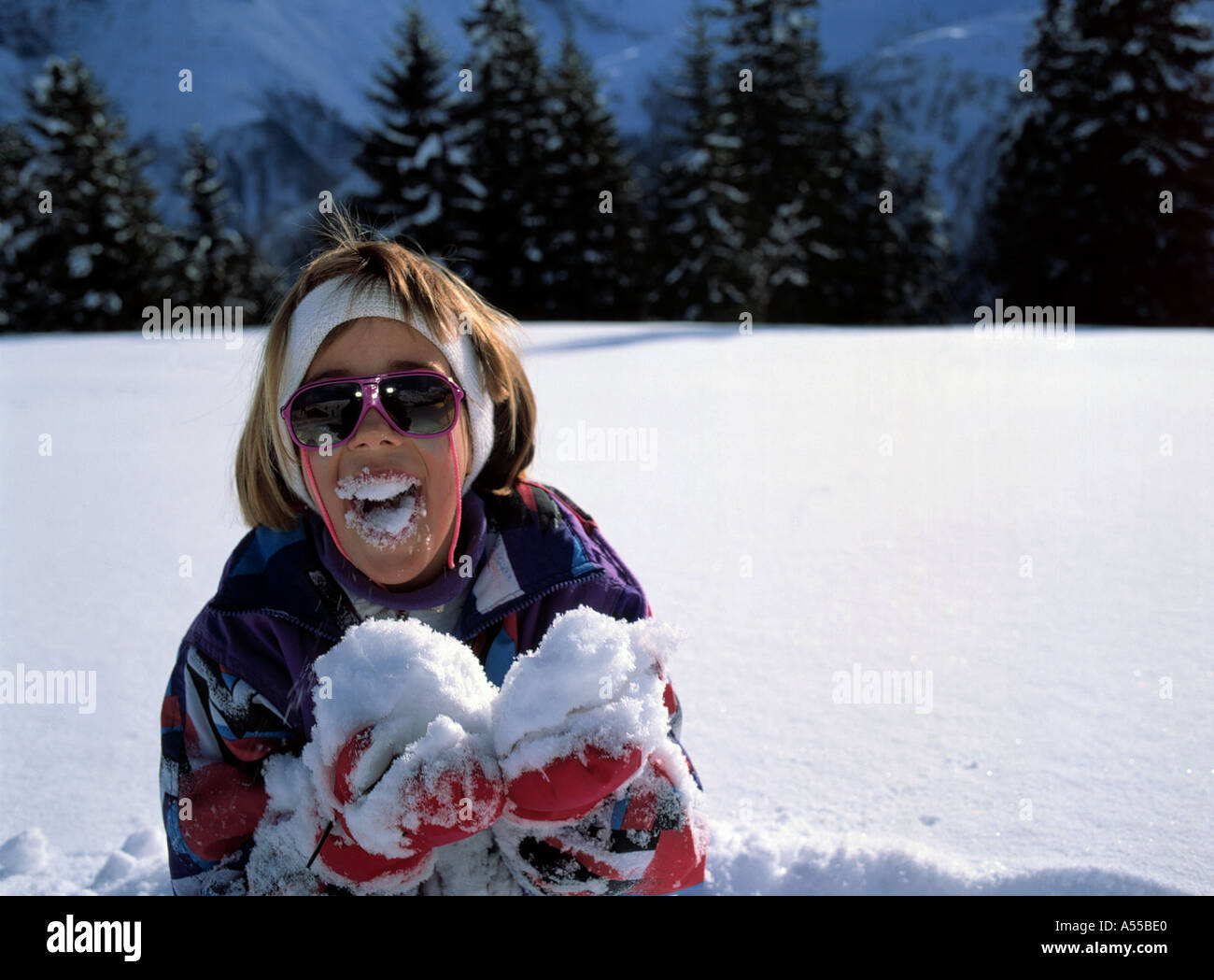 Girl eating snow hi-res stock photography and images - Alamy