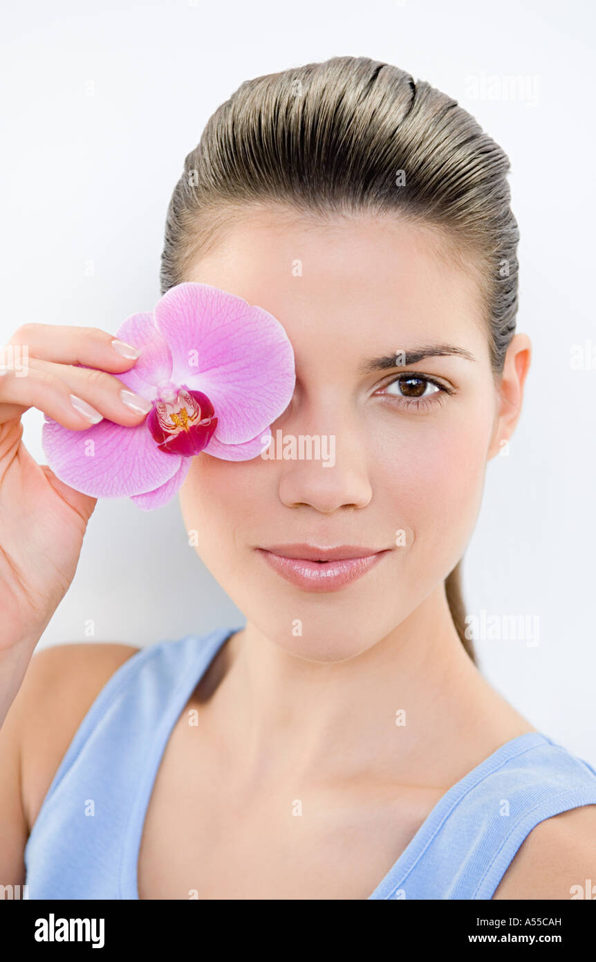 Woman flower over one eye hi-res stock photography and images - Alamy