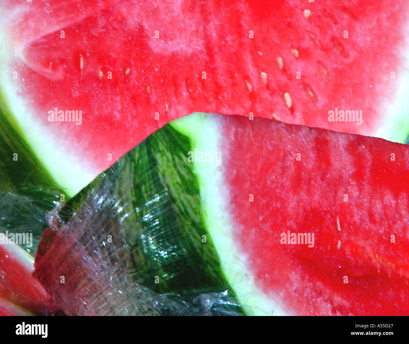 Wedges of watermelon wrapped in plastic Saran wrap Stock Photo - Alamy