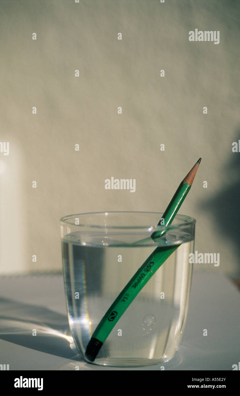 pencil in glass of water, showing refraction Stock Photo - Alamy