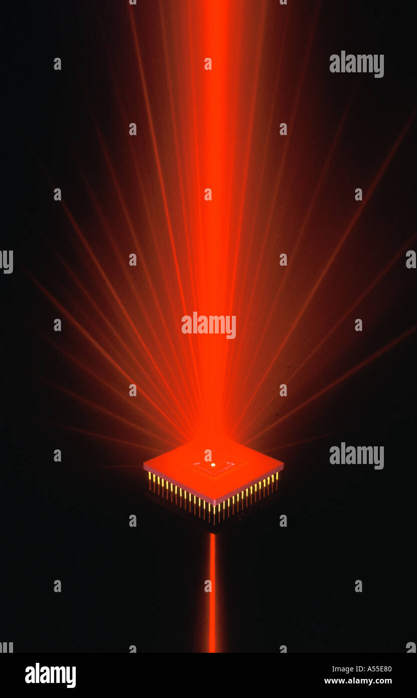 red laser light hitting microprocessor Stock Photo - Alamy