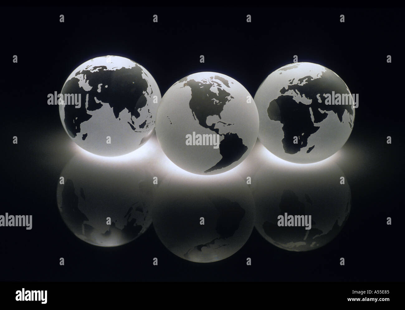 three crystal globes showing left to right Asia Western Hemisphere ...